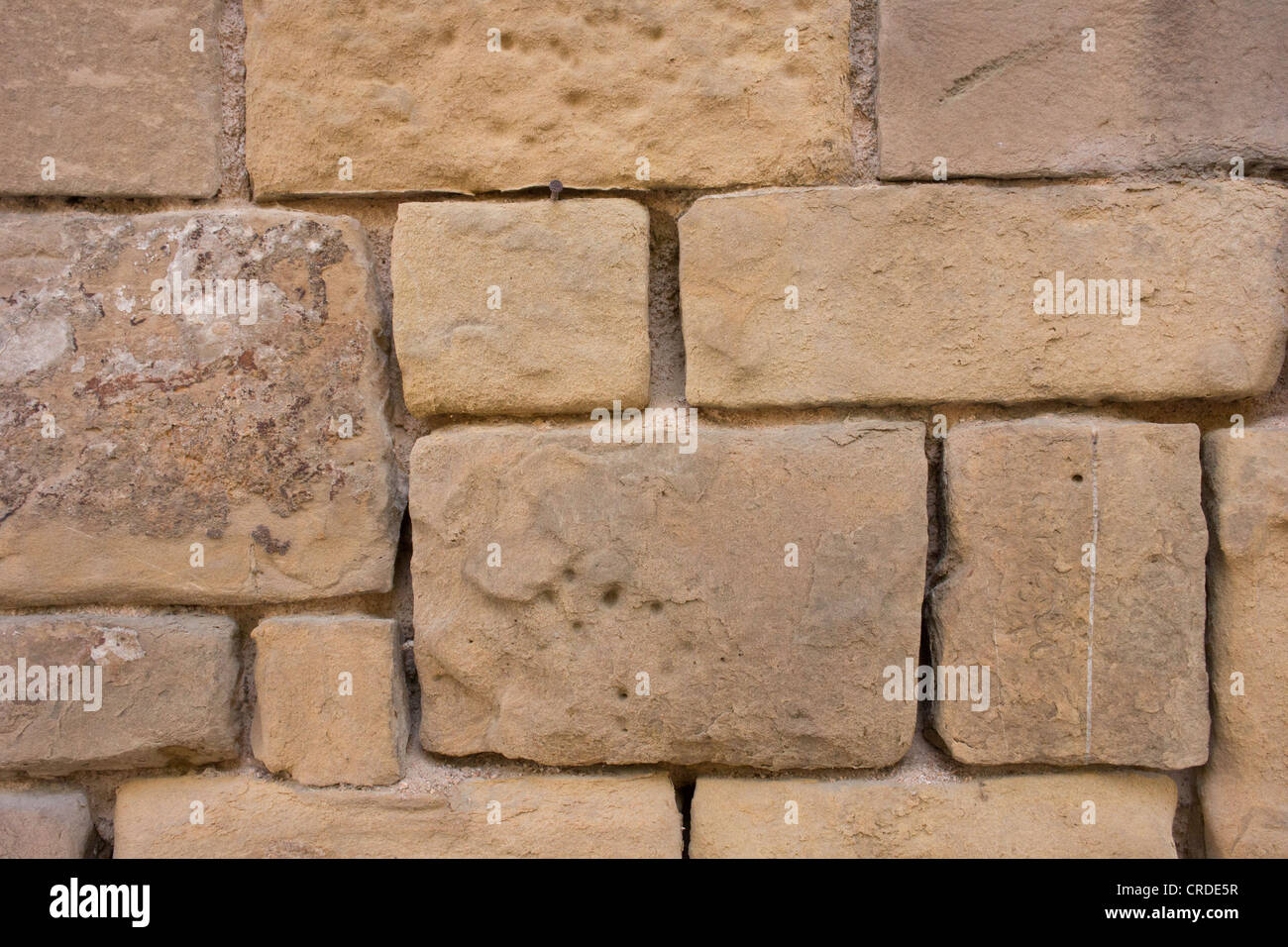 Background image of a wall of irregular square wall Stock Photo - Alamy