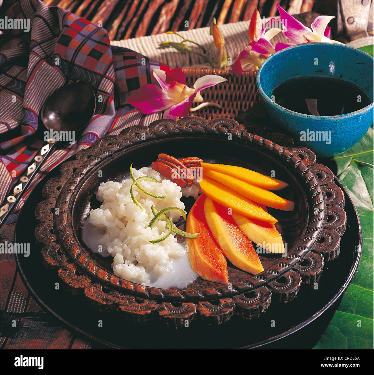 Coconut rice with mango and papaya, Thailand Stock Photo - Alamy