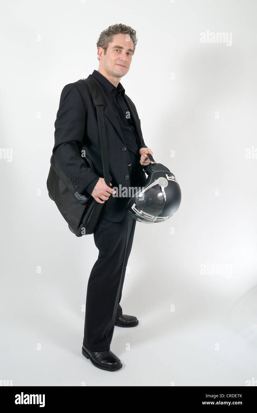 Man carrying motorcycle helmet hi-res stock photography and images - Alamy