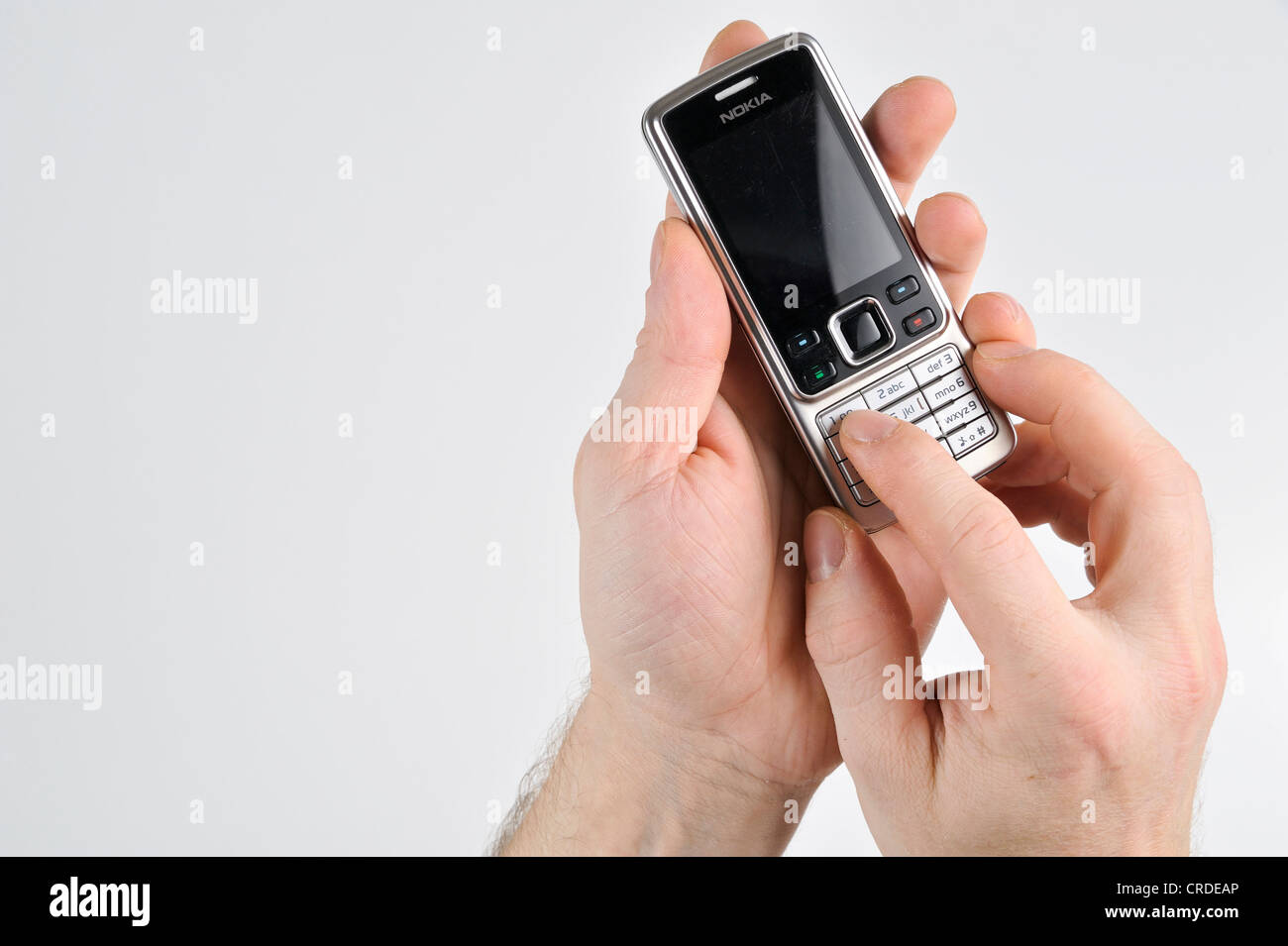 Hands holding a mobile phone Stock Photo - Alamy