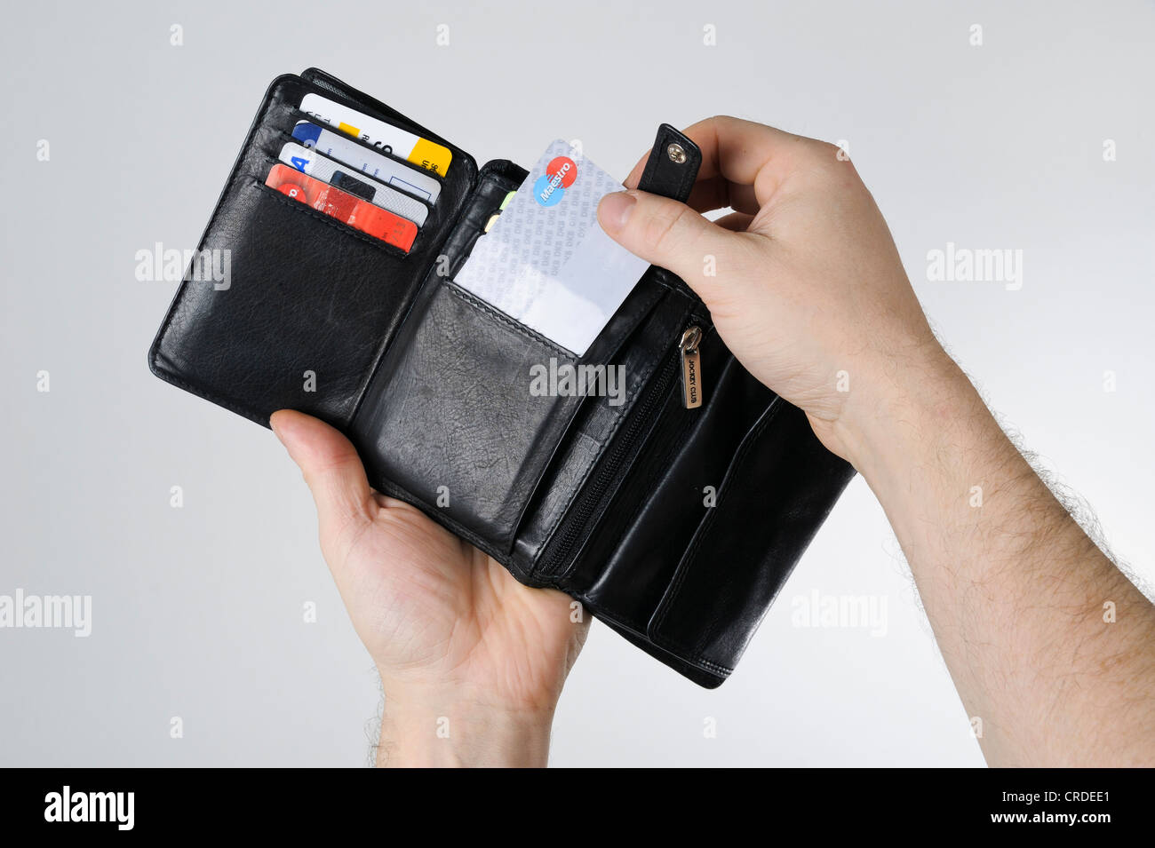 Hands holding a wallet with bank cards Stock Photo - Alamy