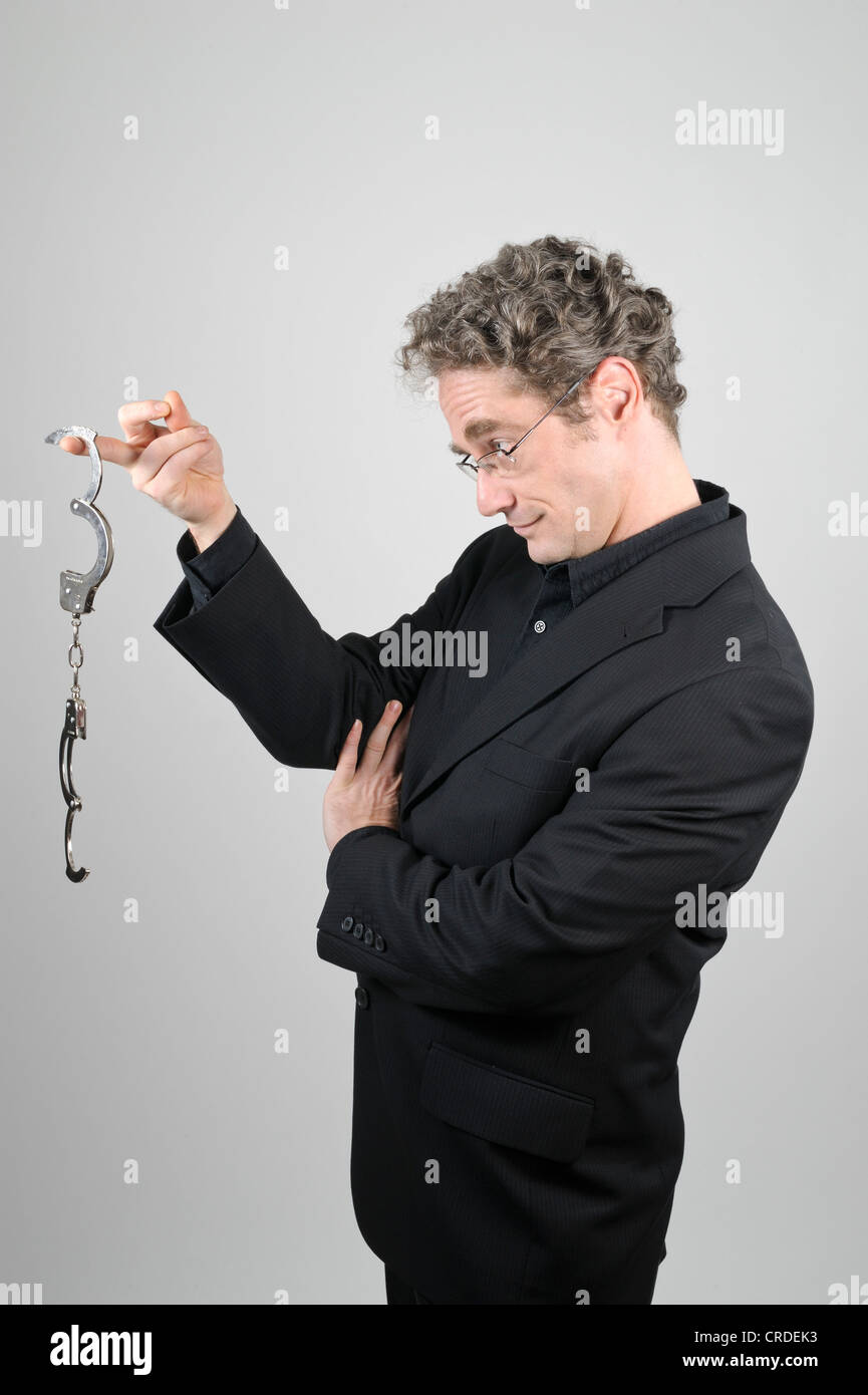 Open handcuffs hi-res stock photography and images - Alamy