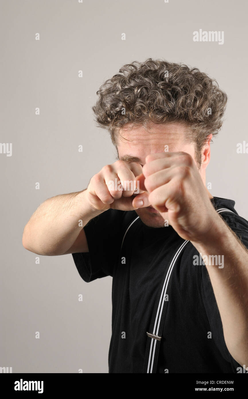Young man boxing fighting pose hi-res stock photography and images - Alamy