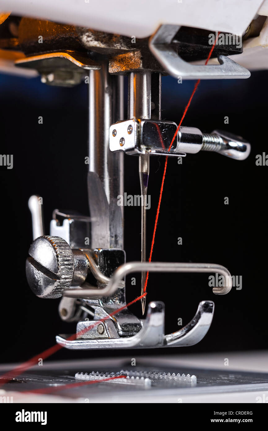 Sewing machine with presser foot and needle plate Stock Photo - Alamy