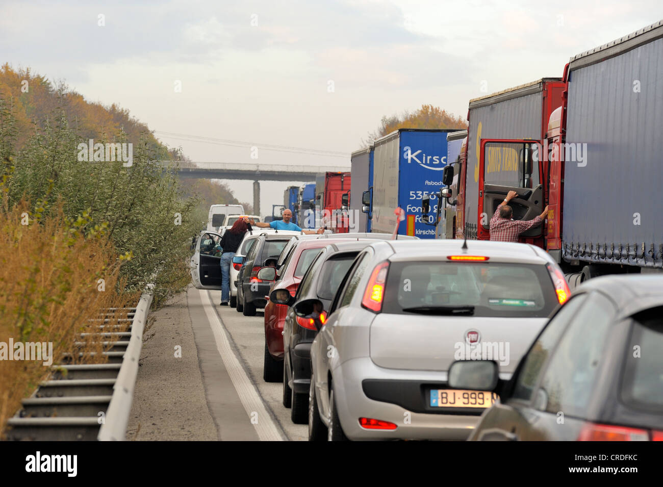 People leaving their cars during a traffic jam on the A61 Autobahn ...