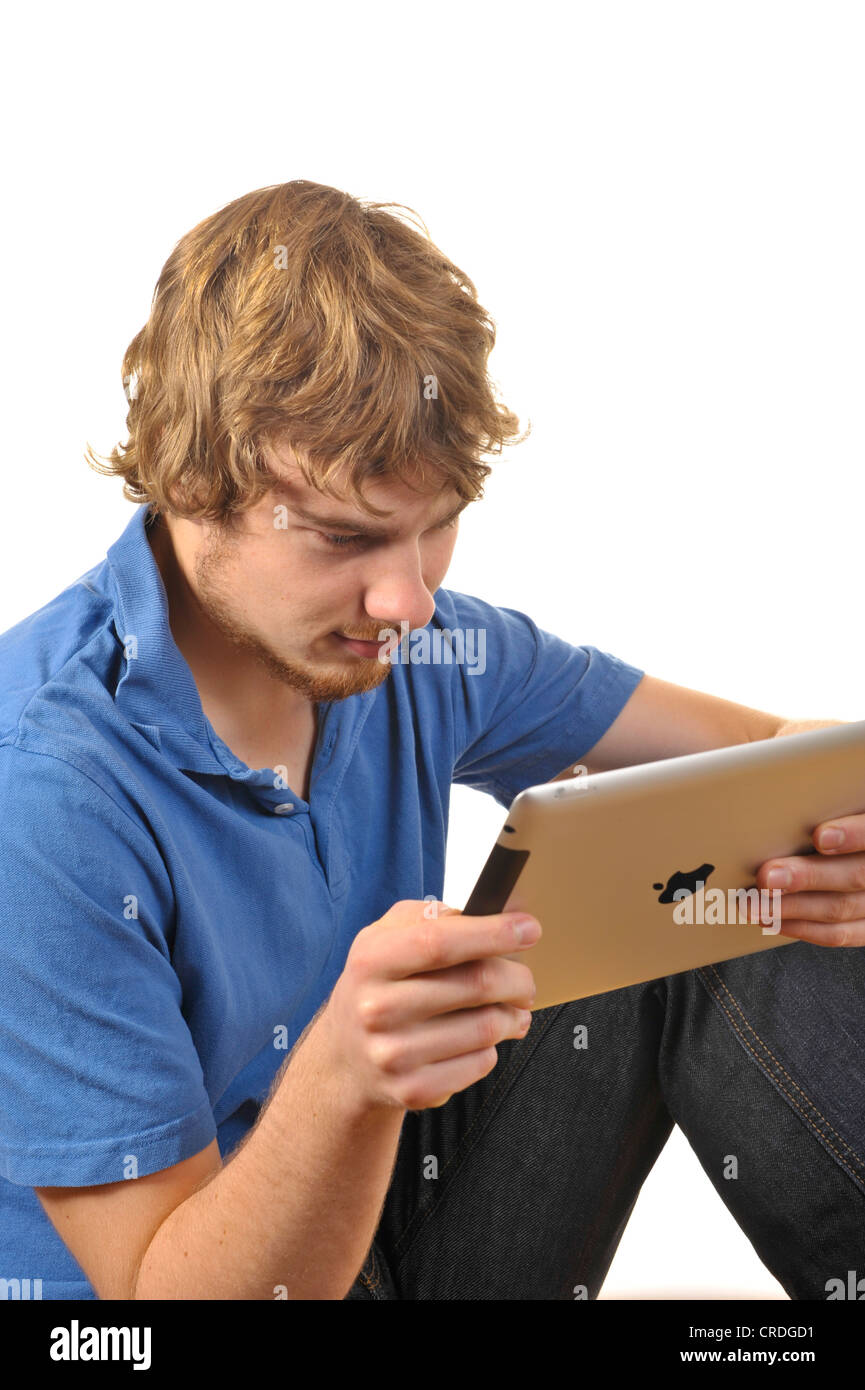 Young man using an iPad Stock Photo - Alamy