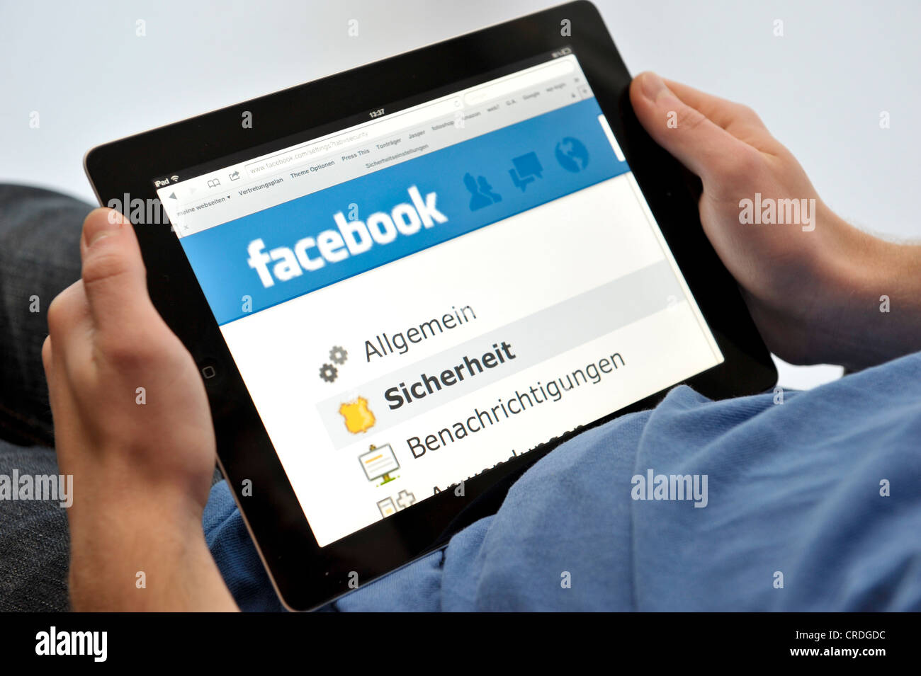 Man surfing the website of Facebook Stock Photo - Alamy