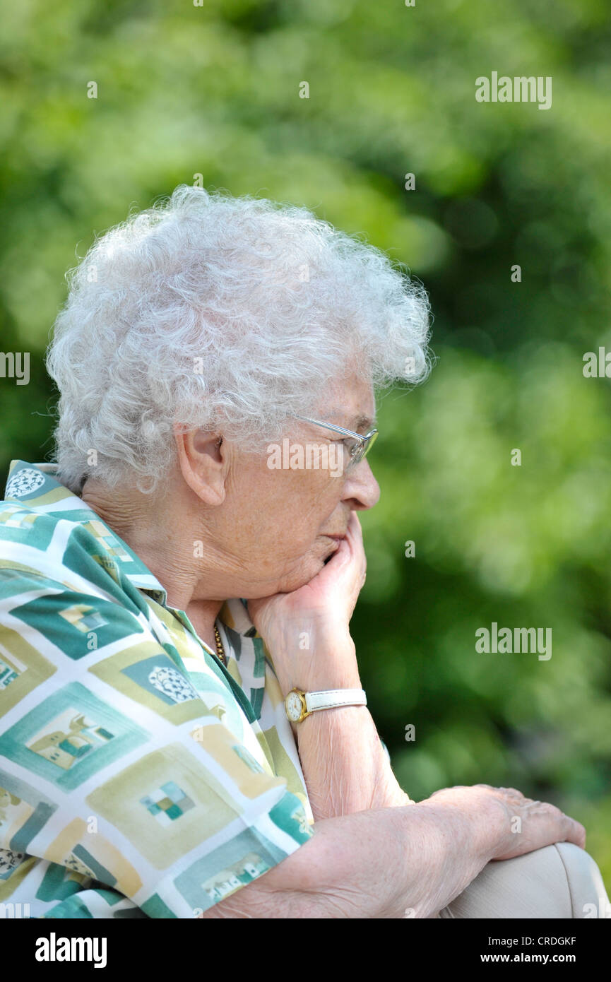 Pensive elderly woman, senior Stock Photo - Alamy