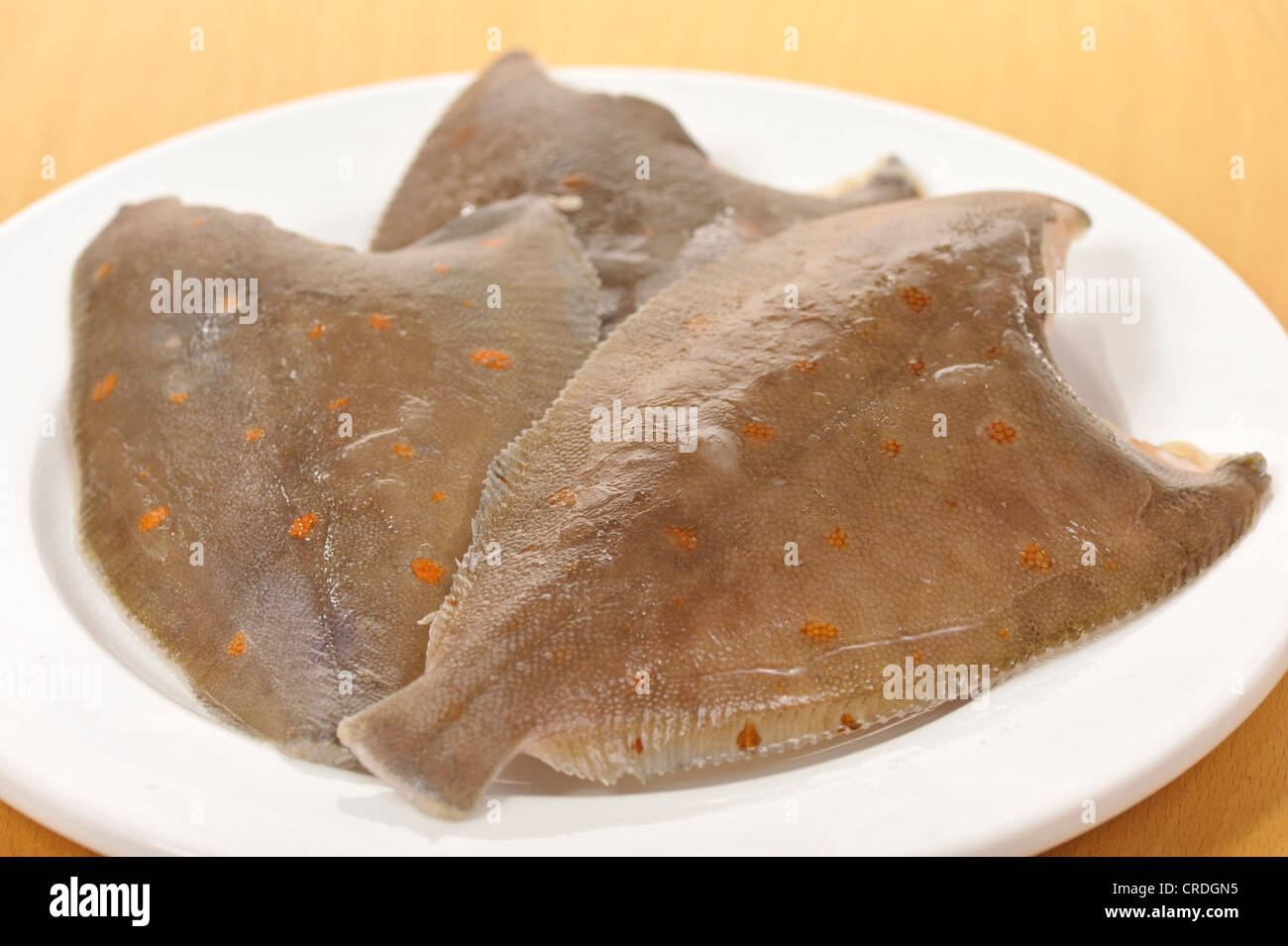 Plaice on a plate Stock Photo - Alamy