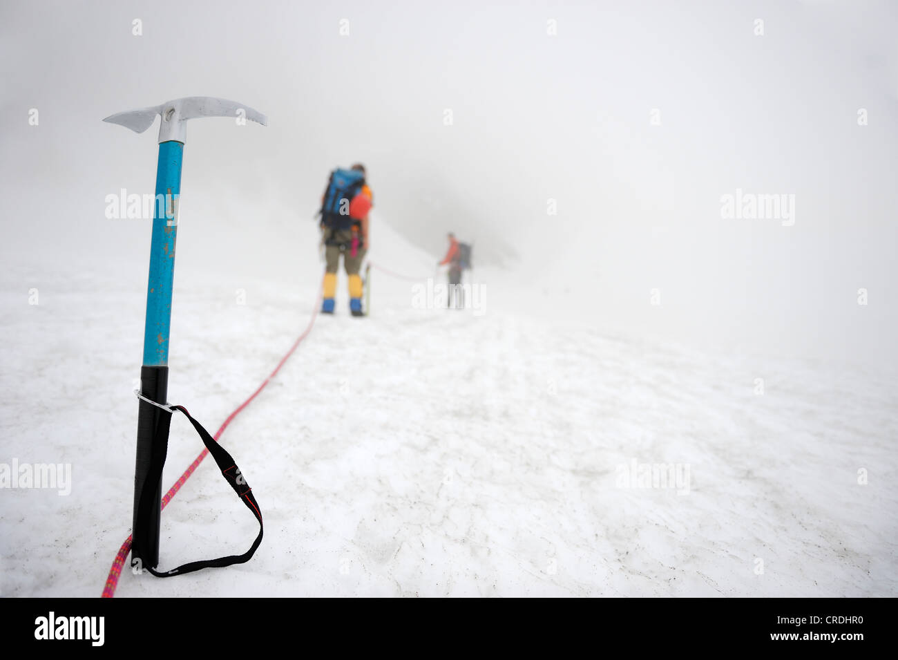 Ice pick with rope team on glacier, Chur, Canton Grisons, Switzerland ...