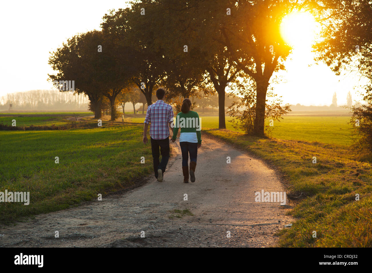 Young couple taking a walk outdoors, in nature Stock Photo - Alamy