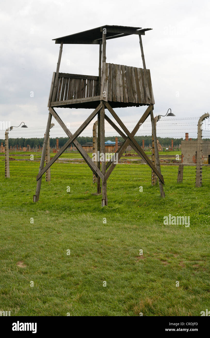 Fence and guard tower in the concentration camp, Auschwitz-Birkenau ...