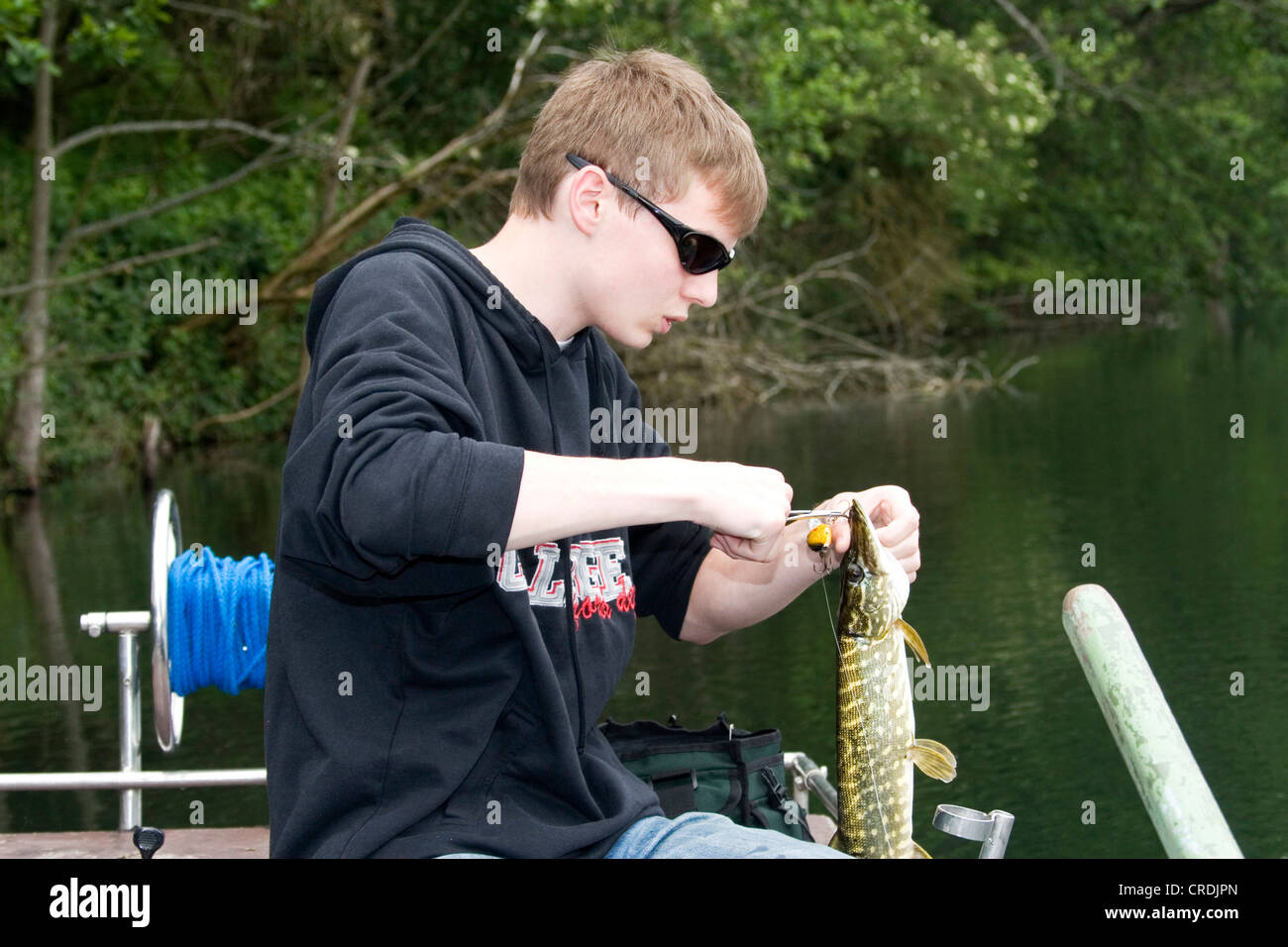 Little pike on fishhook hi-res stock photography and images - Alamy