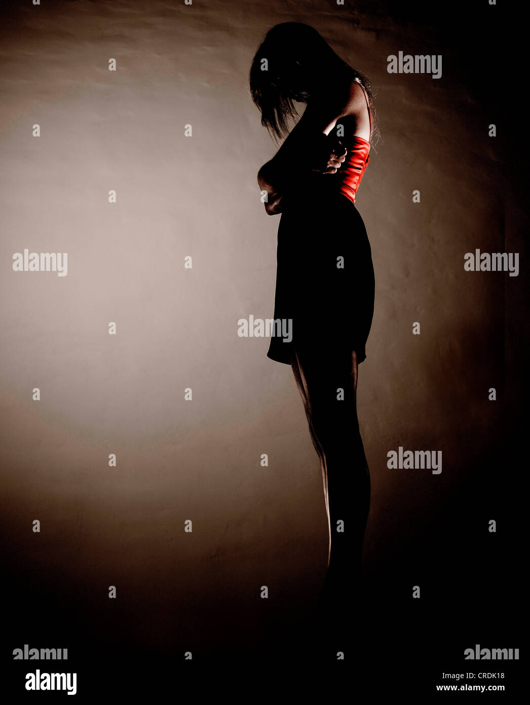 Woman back in backlit contemplates hi-res stock photography and images ...