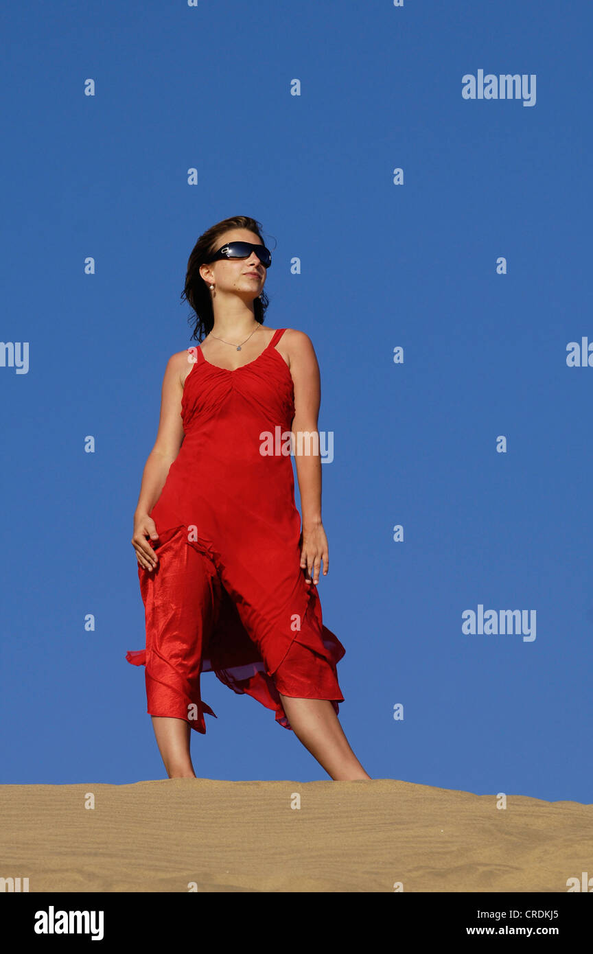 young woman standing on sand Stock Photo - Alamy