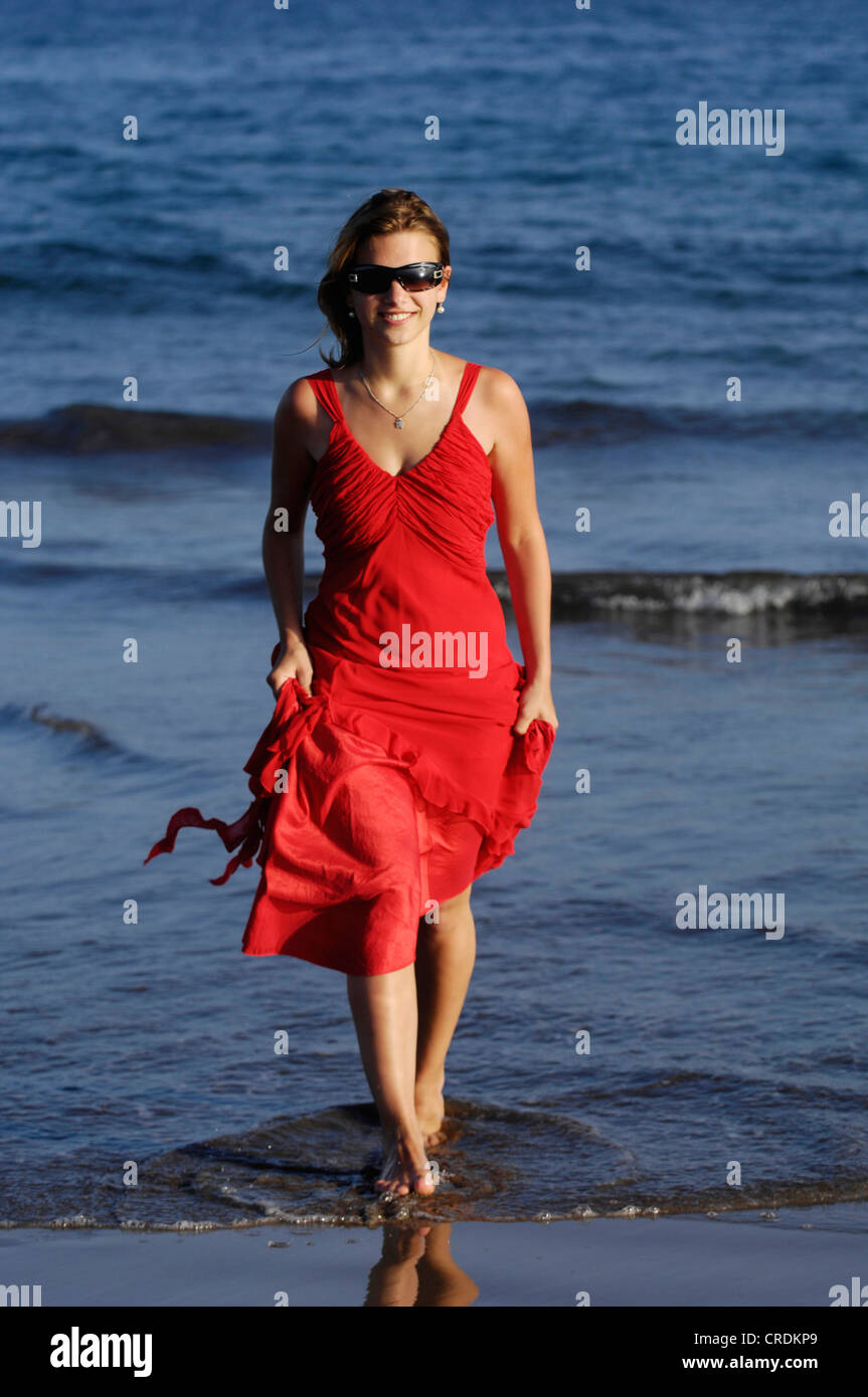 young cute woman walking at the beach Stock Photo - Alamy