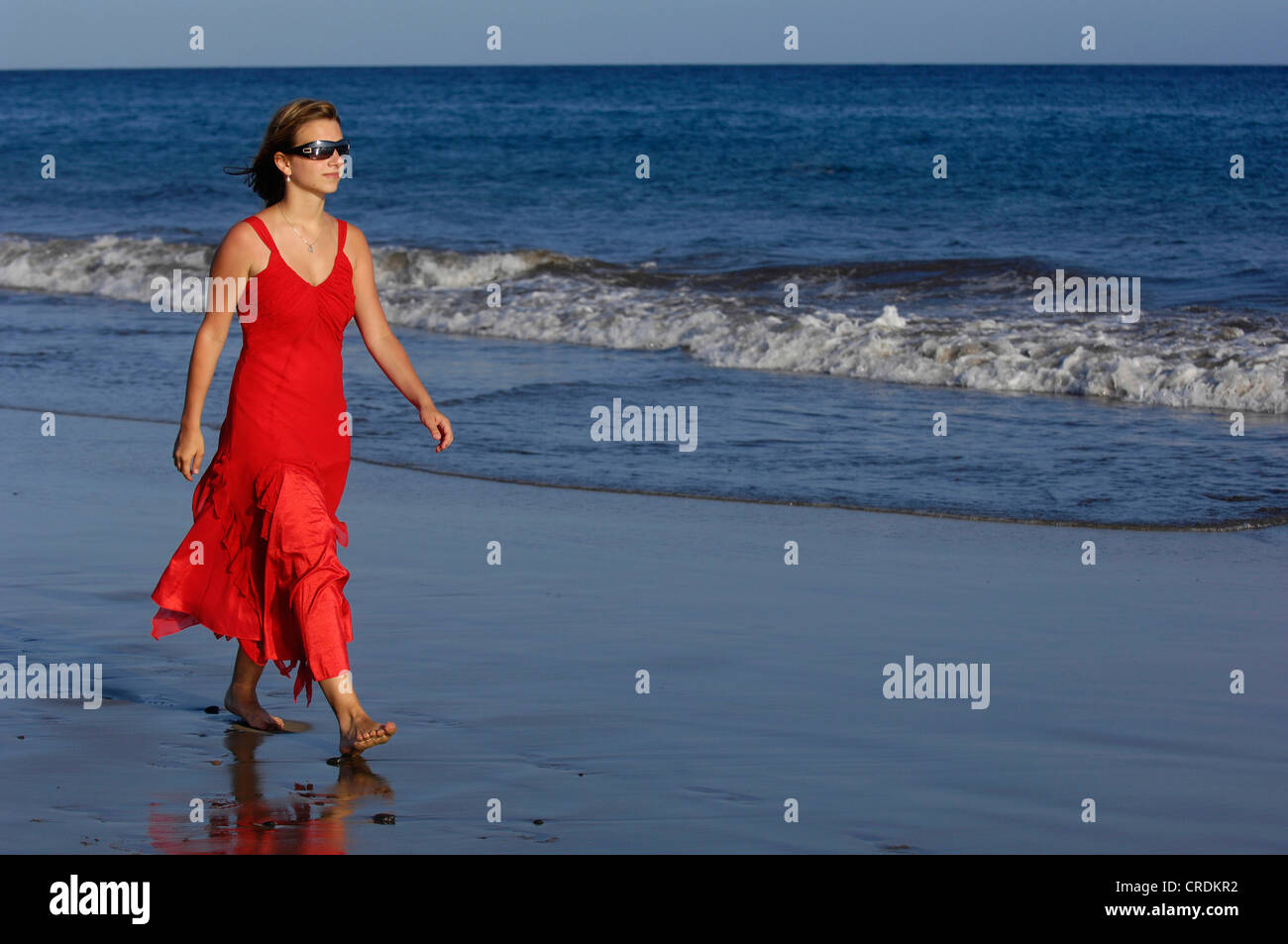 young cute woman walking at the beach Stock Photo - Alamy