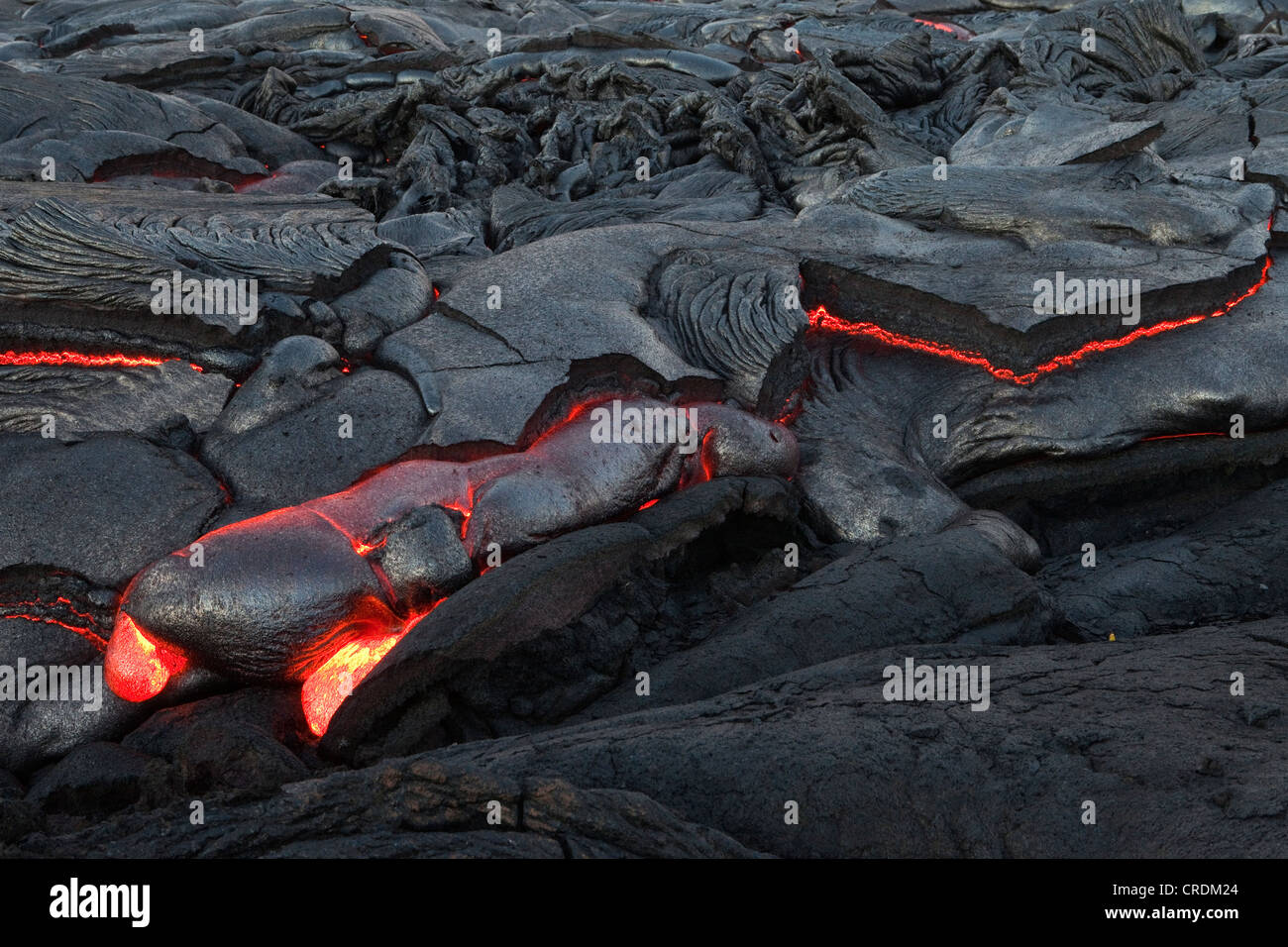 Molten pahoehoe type lava flowing from a crack in the East Rift Zone ...