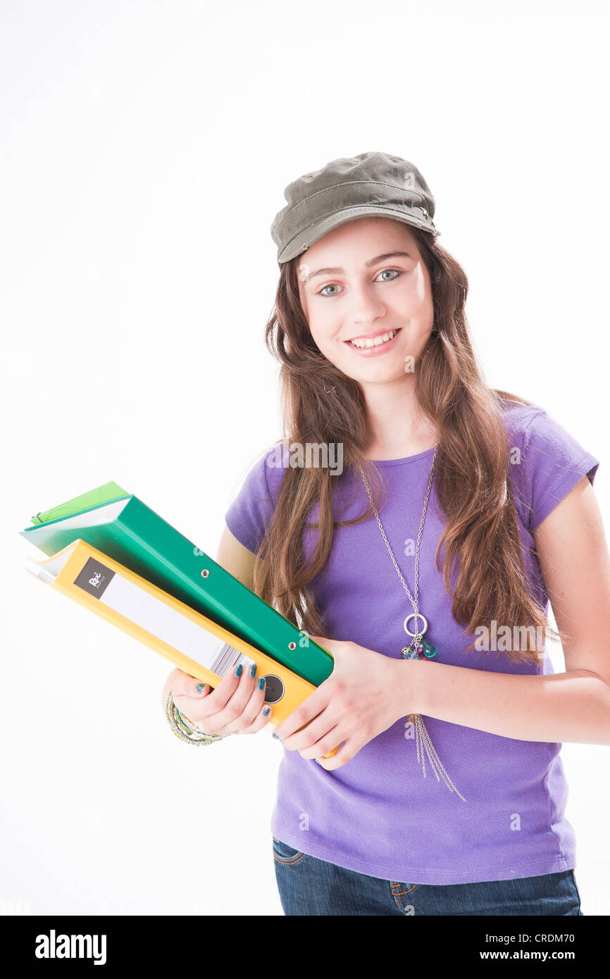 Smiling teenage girl with school folders Stock Photo - Alamy