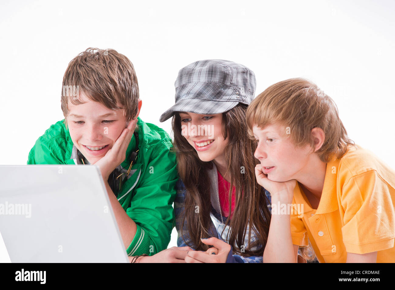 Three friends, one girl and two boys, on a laptop Stock Photo - Alamy