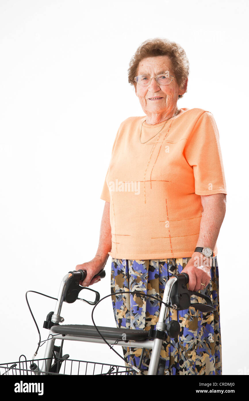 Senior citizen with a rolling walker Stock Photo - Alamy