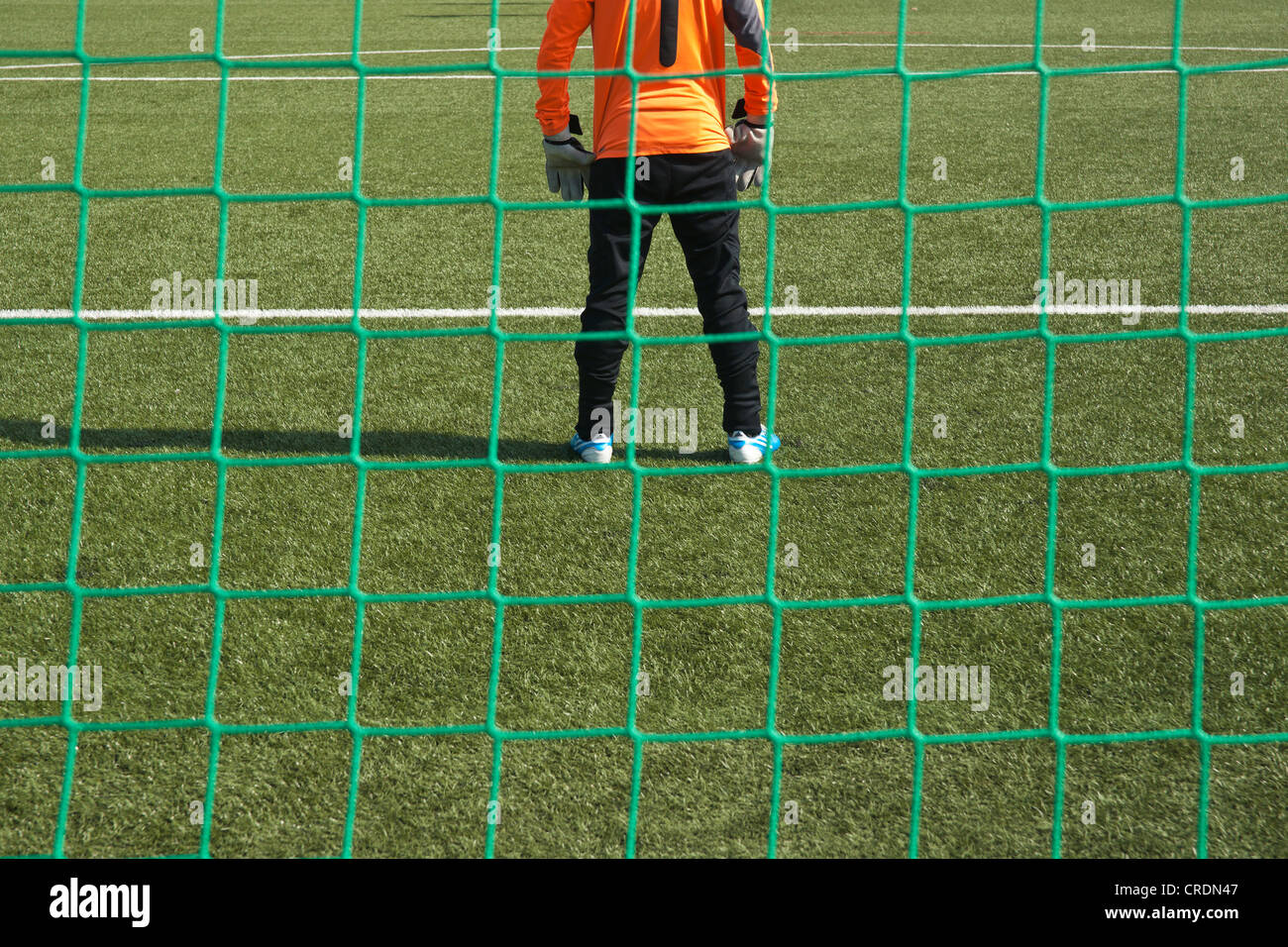 Goalkeeper standing in the goal Stock Photo - Alamy