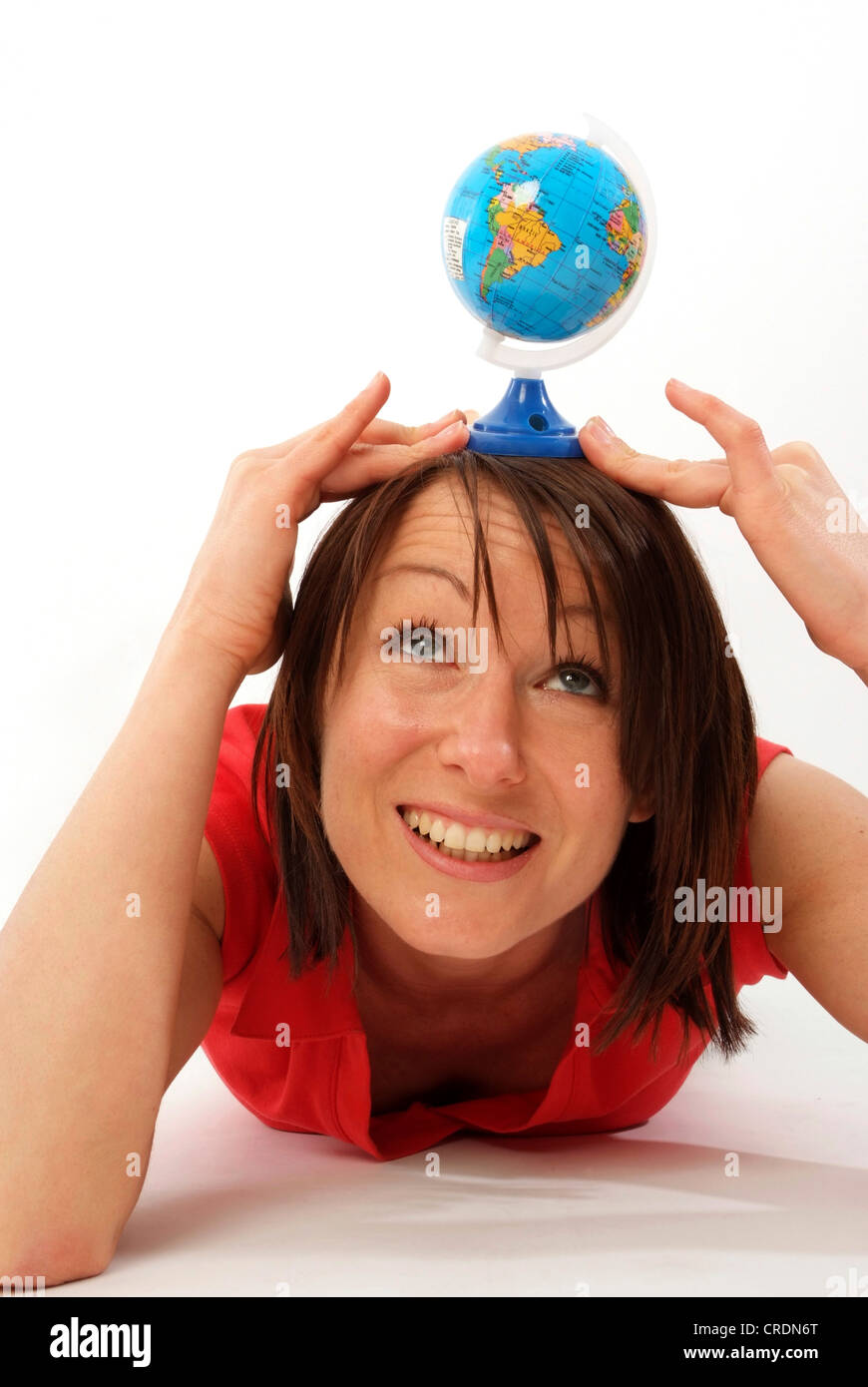 young woman with globe on her head Stock Photo - Alamy