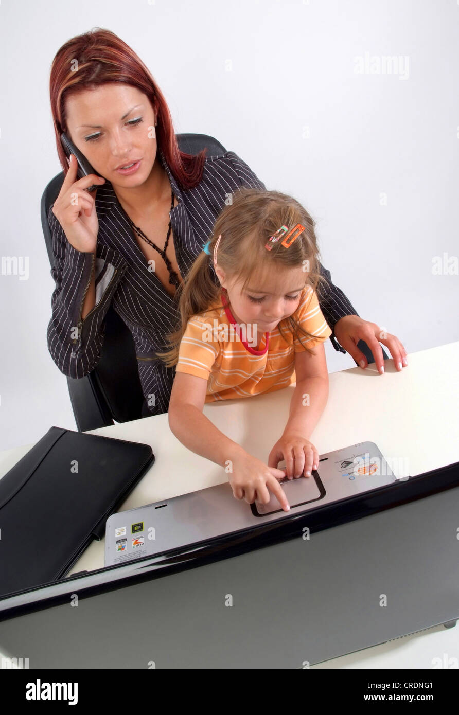 mother with child at work Stock Photo - Alamy