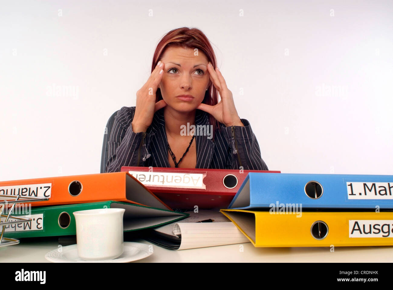 stressed, overcharged businesswoman at the office Stock Photo - Alamy