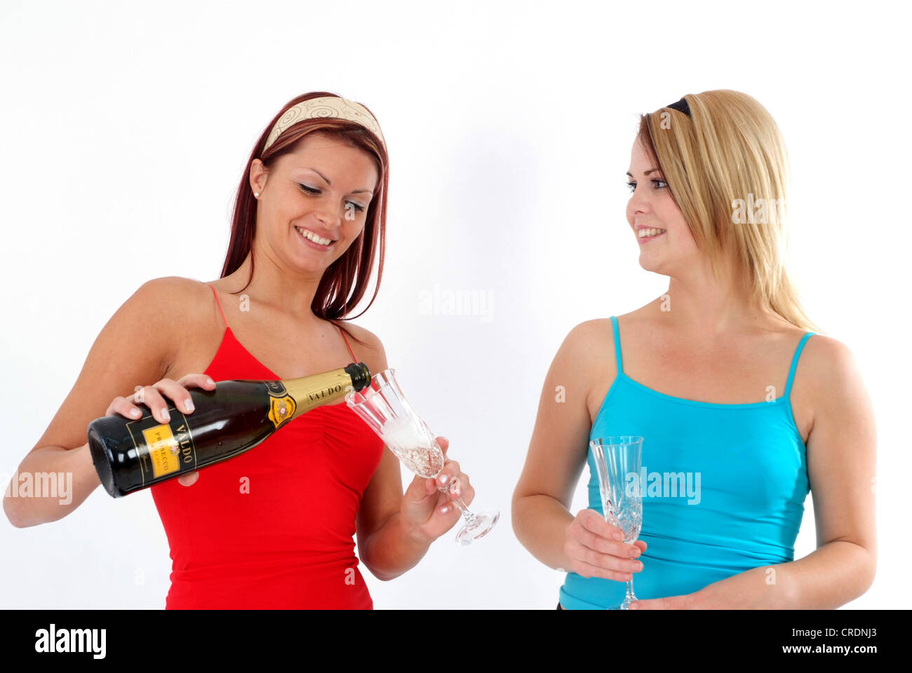 young women drinking sparkling wine Stock Photo - Alamy