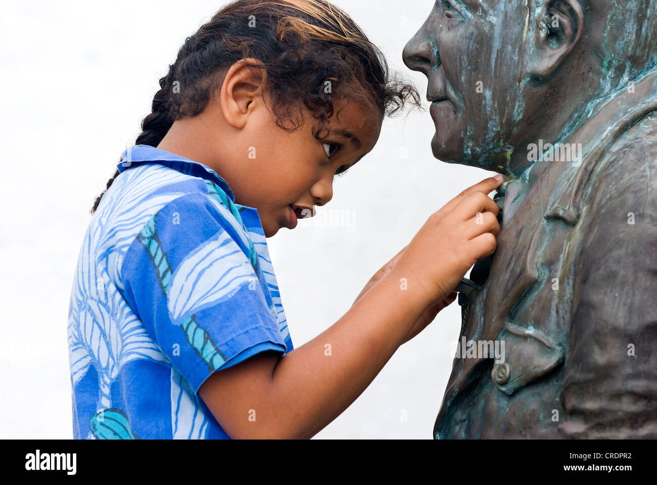 girl with statue in cemetary, avarua cook islands christian church ...
