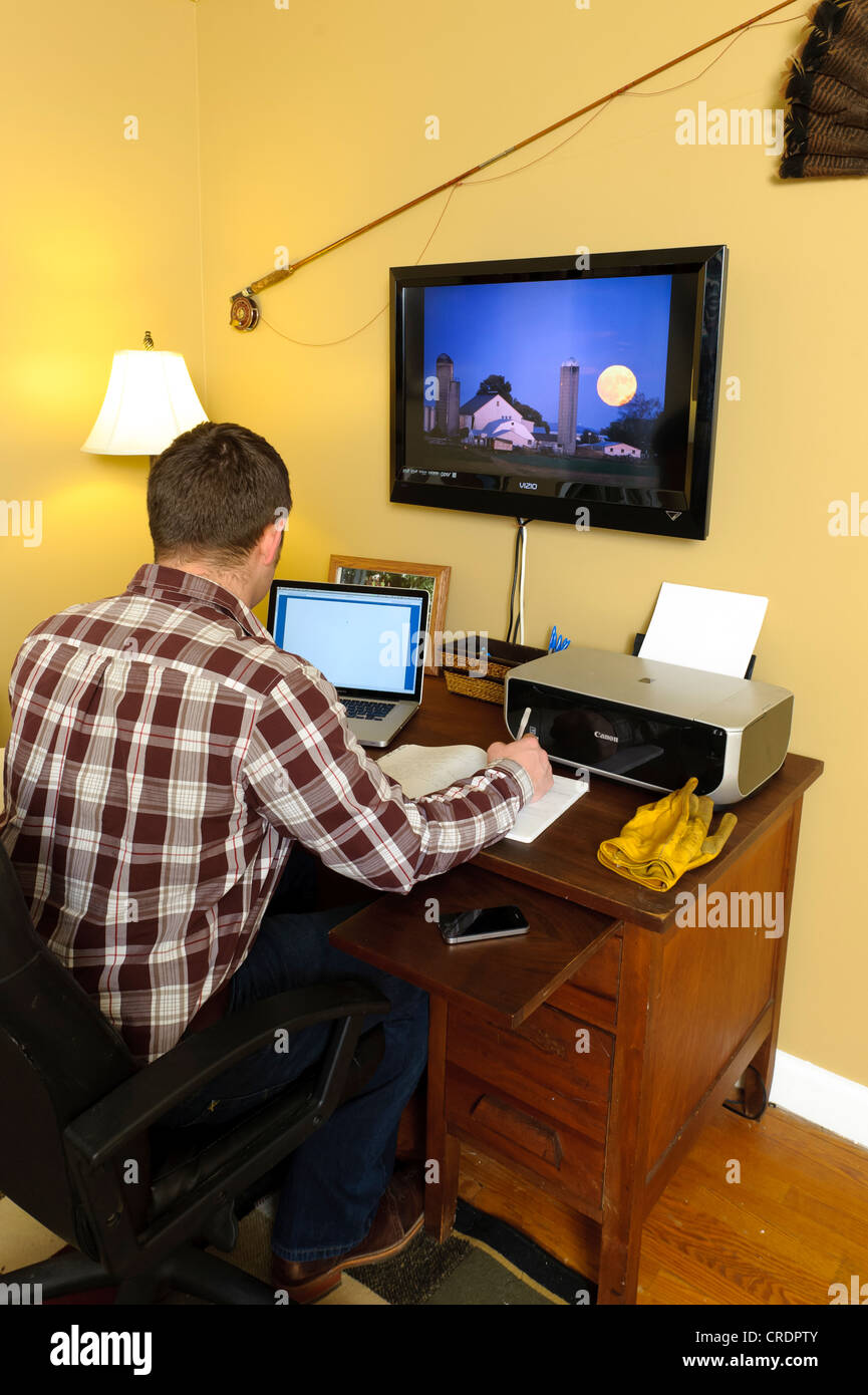 FARMER IN HOME OFFICE USING LAPTOP COMPUTER; WORKING FROM HOME Stock ...