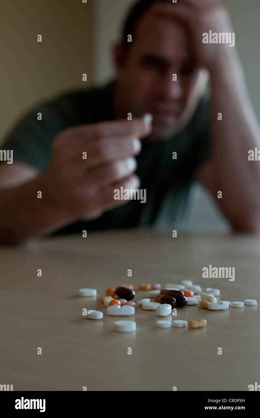 Dejected man looking down hi-res stock photography and images - Alamy