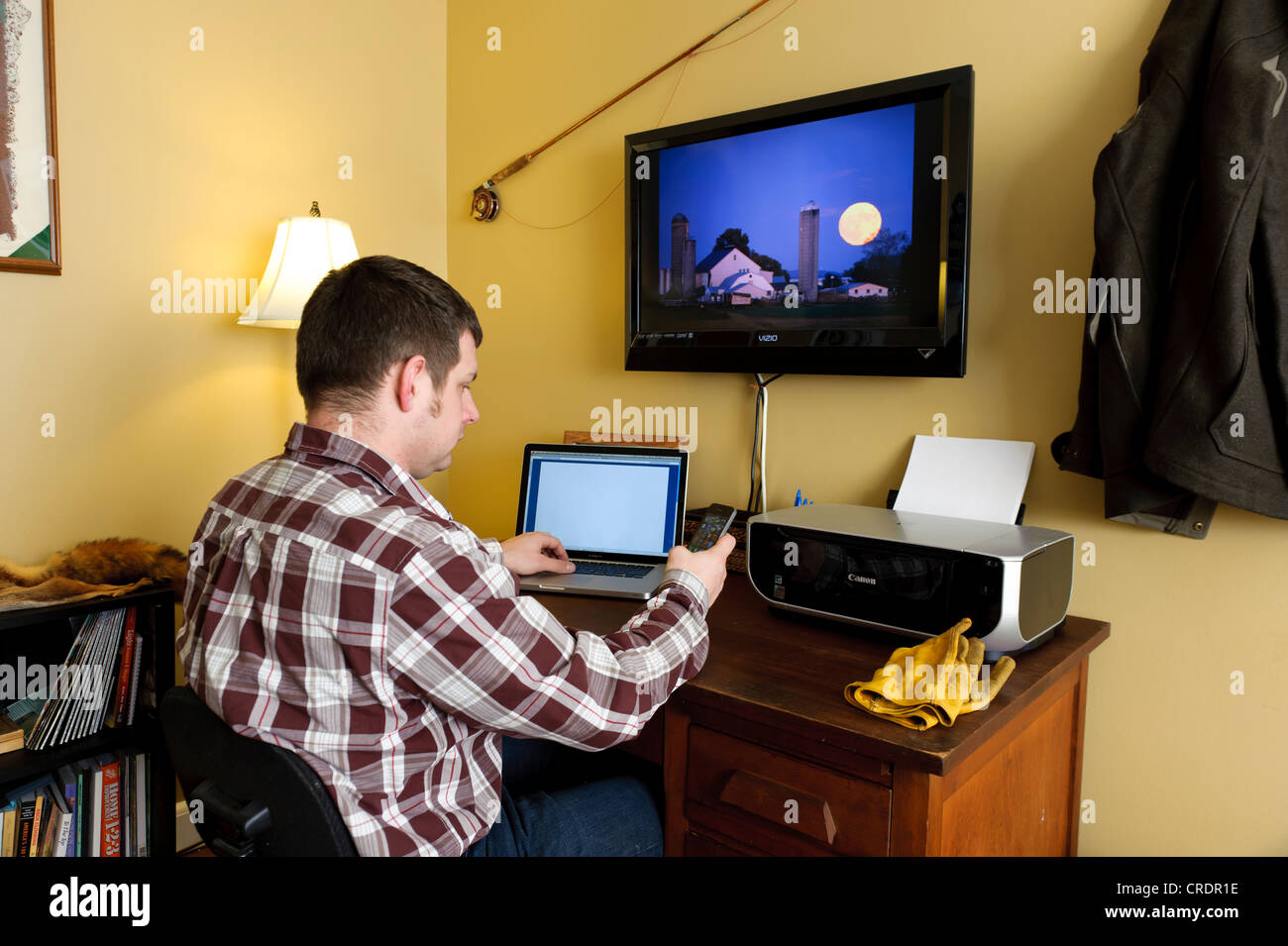 FARMER IN HOME OFFICE USING LAPTOP COMPUTER; WORKING FROM HOME Stock ...
