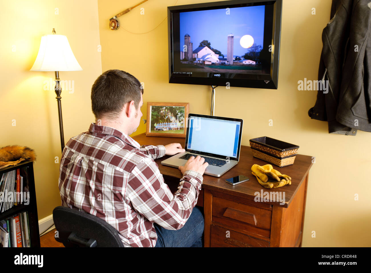 FARMER IN HOME OFFICE USING LAPTOP COMPUTER; WORKING FROM HOME Stock ...