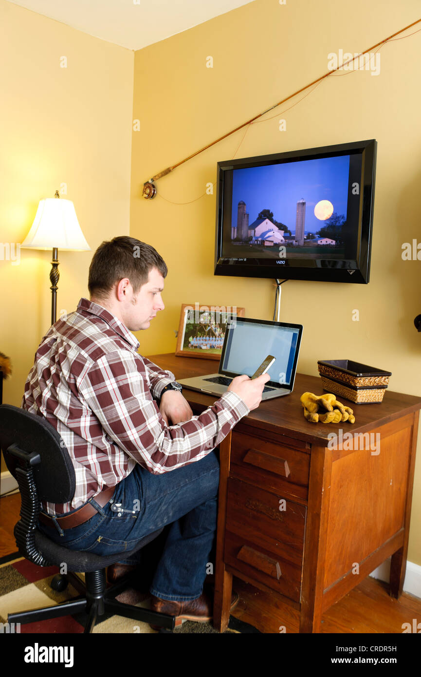 FARMER IN HOME OFFICE USING LAPTOP COMPUTER; WORKING FROM HOME Stock ...