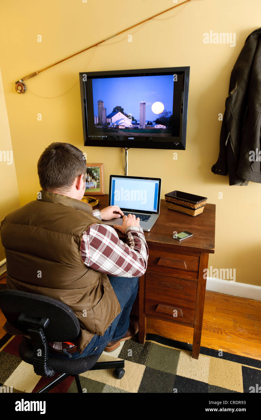 FARMER IN HOME OFFICE USING LAPTOP COMPUTER; WORKING FROM HOME Stock ...