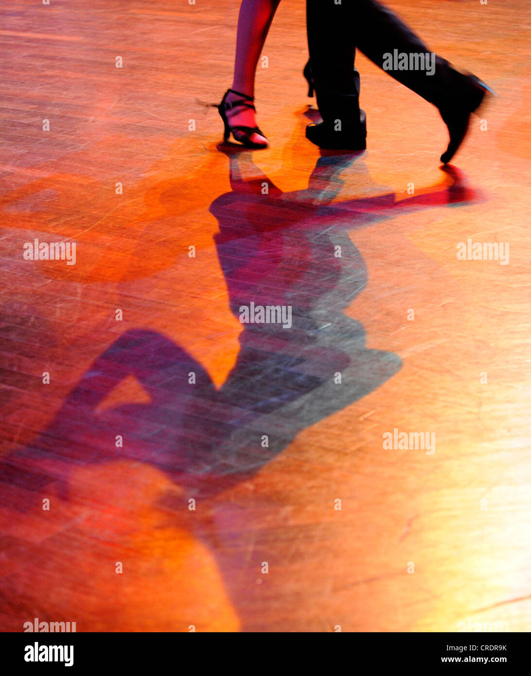legs and shadow of dancing couple Stock Photo - Alamy