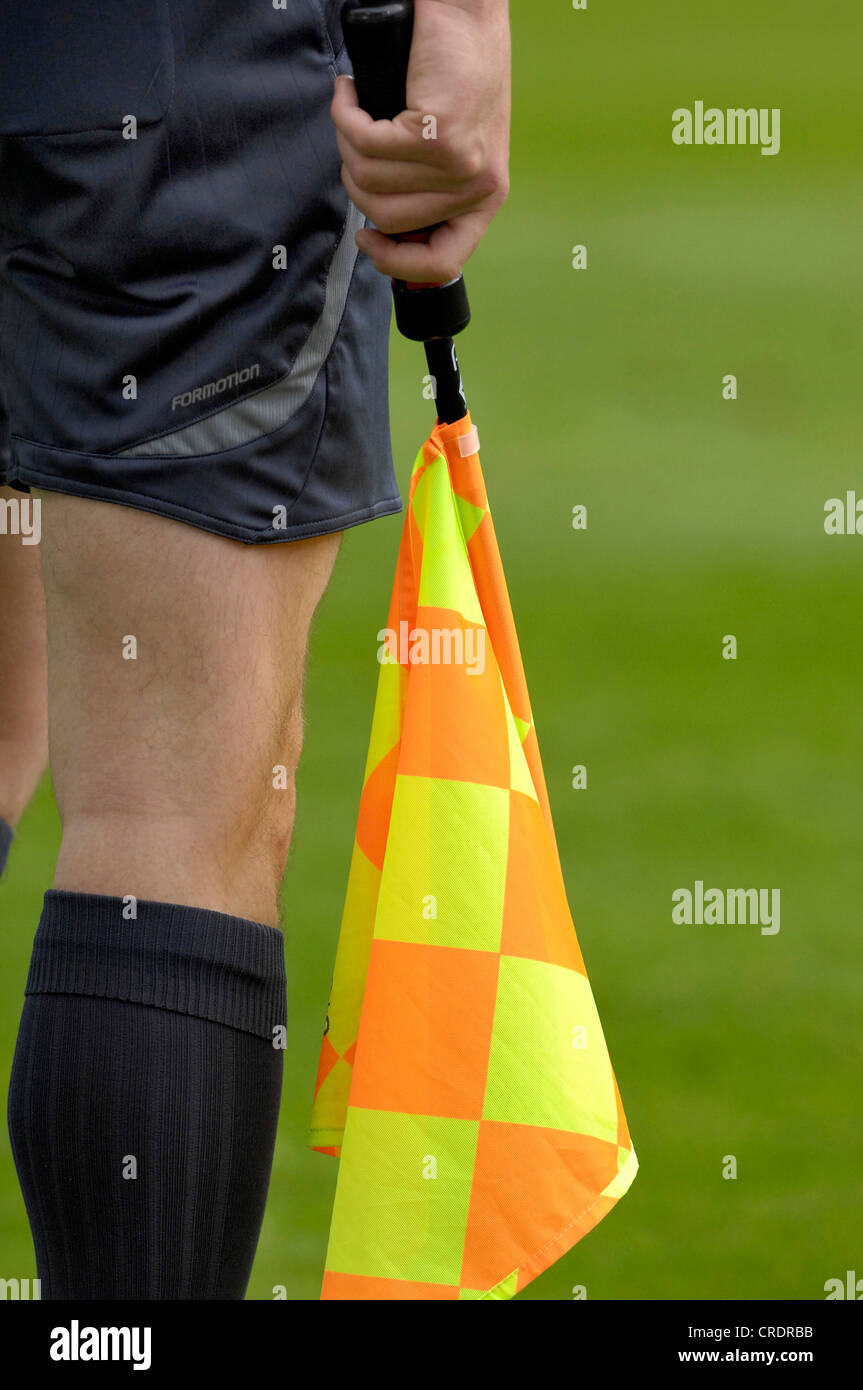 linesman's leg and flag Stock Photo - Alamy