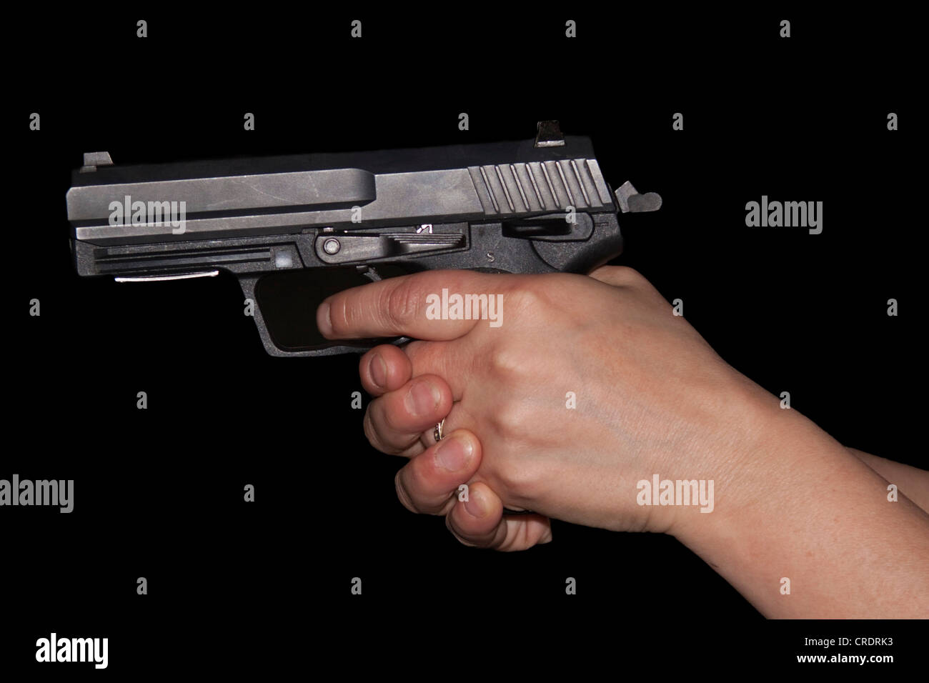 Gun, pistol, women's hands Stock Photo - Alamy