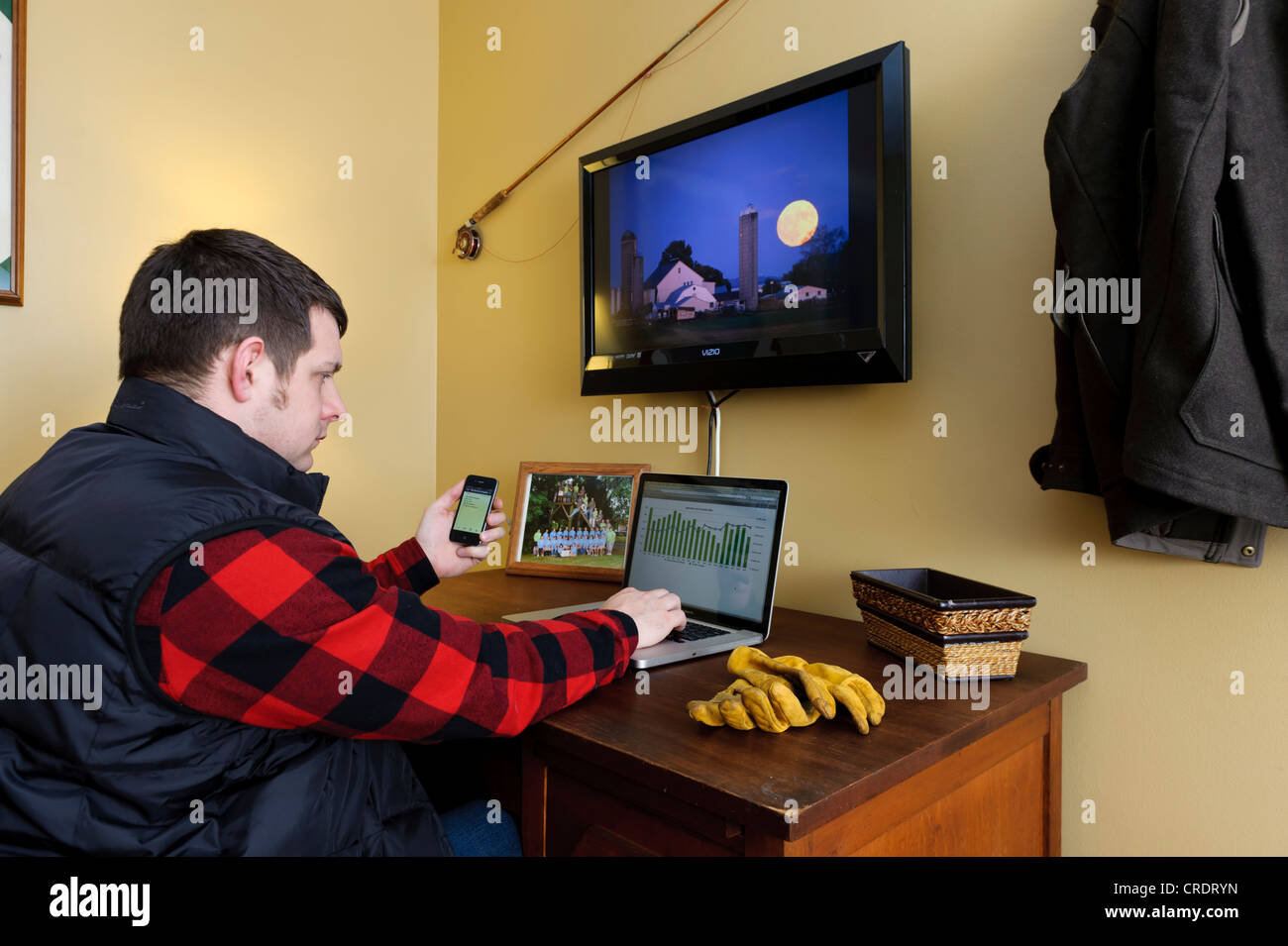 FARMER IN HOME OFFICE USING LAPTOP COMPUTER; WORKING FROM HOME Stock ...