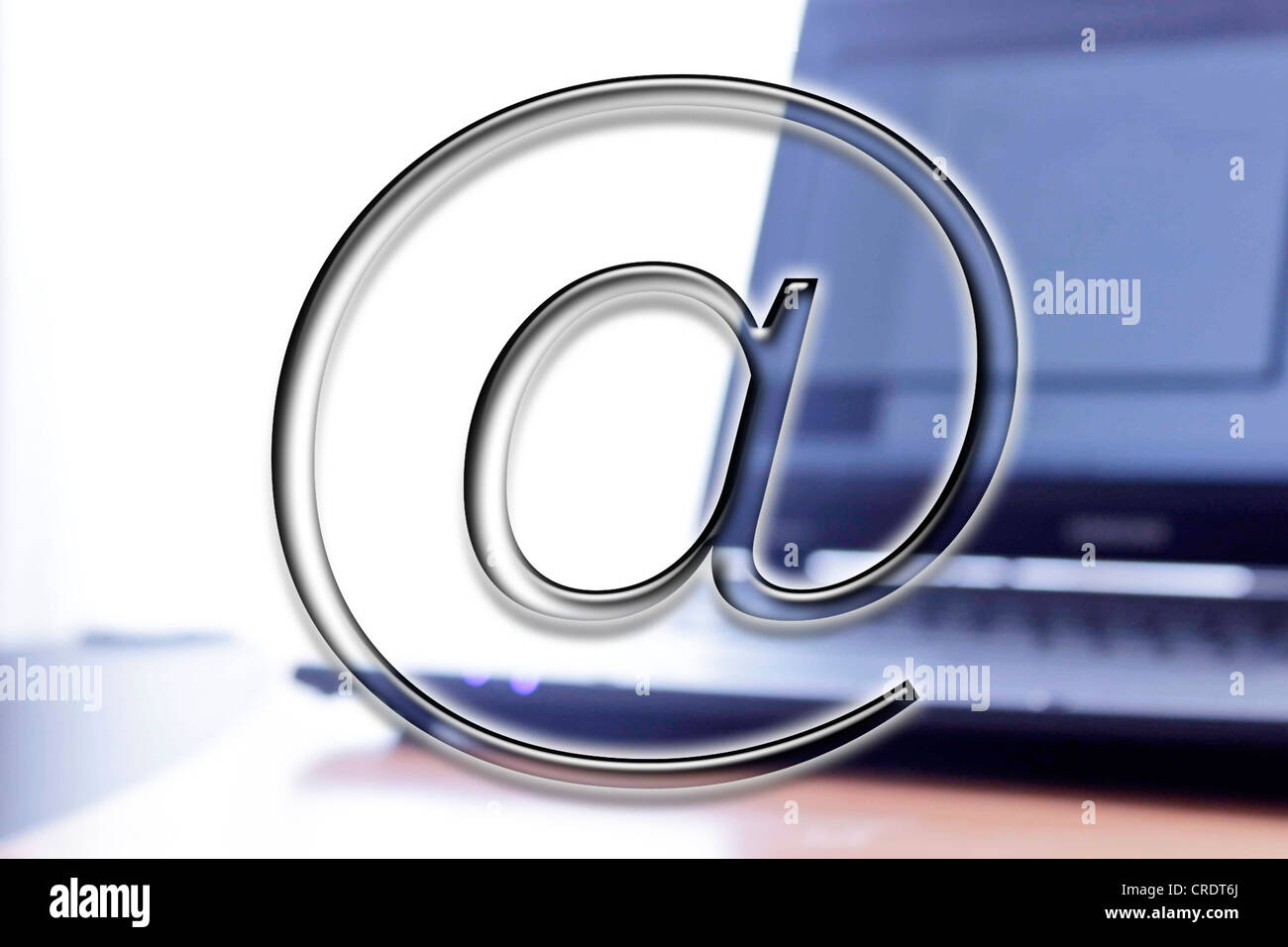 At sign with laptop Stock Photo - Alamy