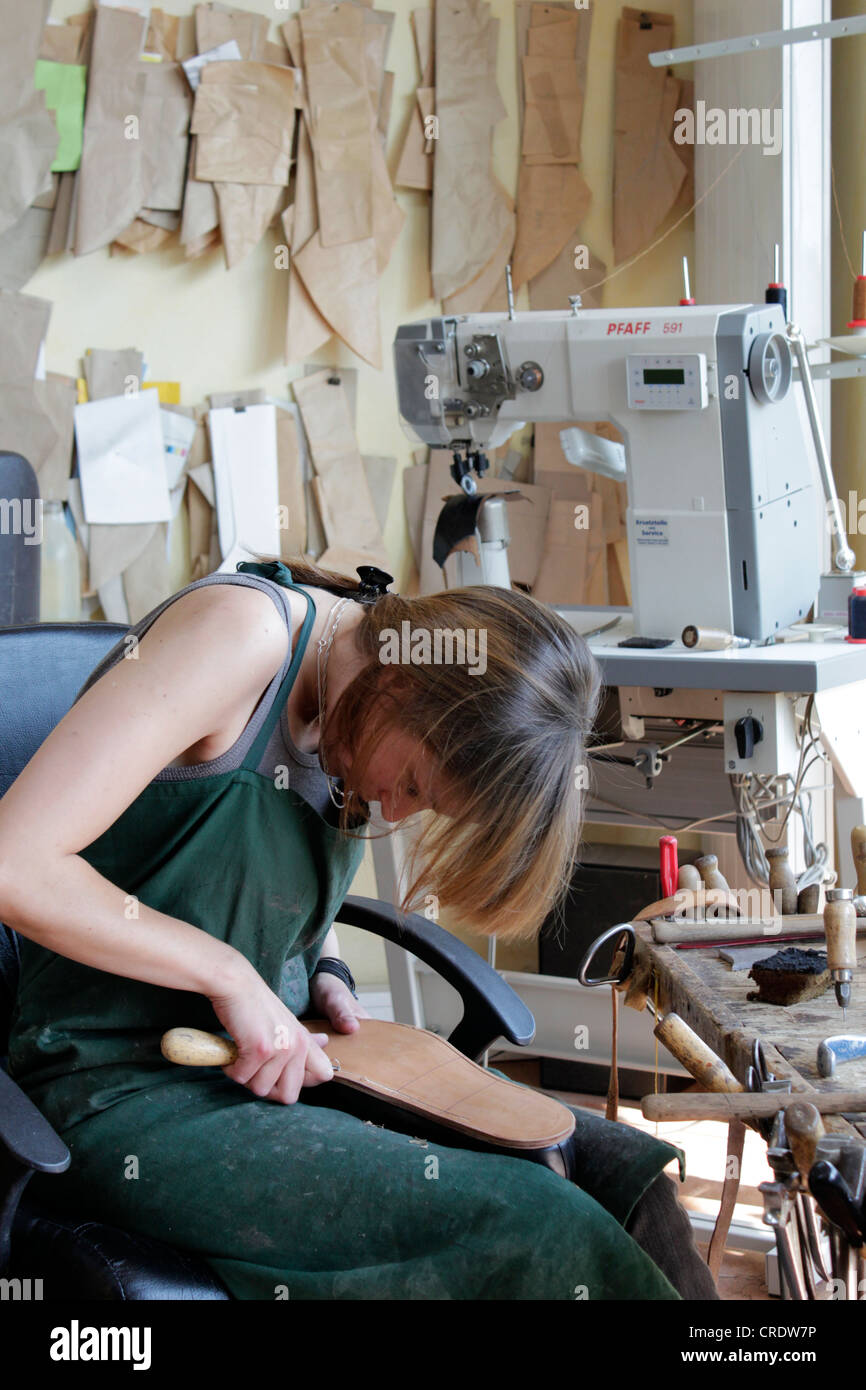 A cobbler at work in the workshop Stock Photo - Alamy