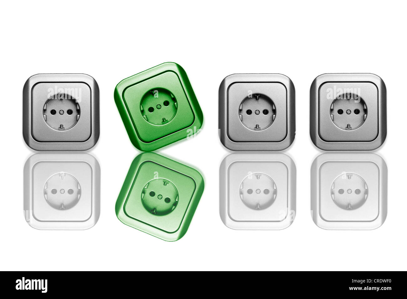 Three grey sockets, one green socket Stock Photo - Alamy