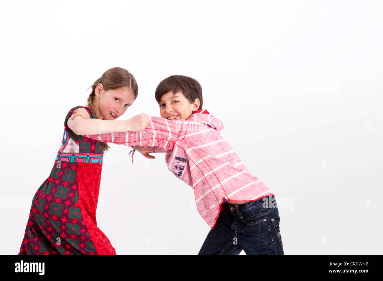 Girl and boy, 9 years, having an argument Stock Photo - Alamy