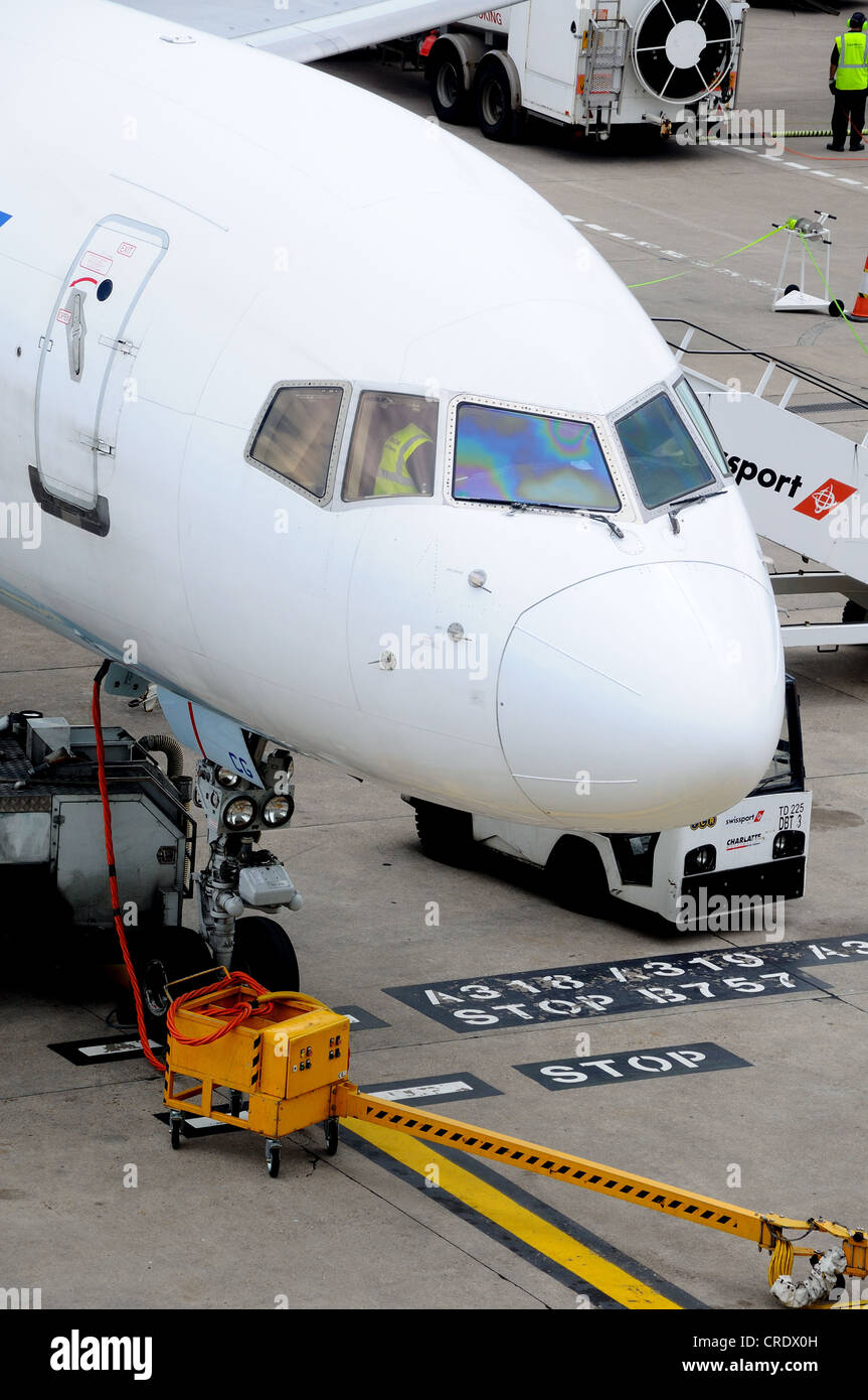 Nose of Boeing 757 airliner seen connected to remote power supply ...