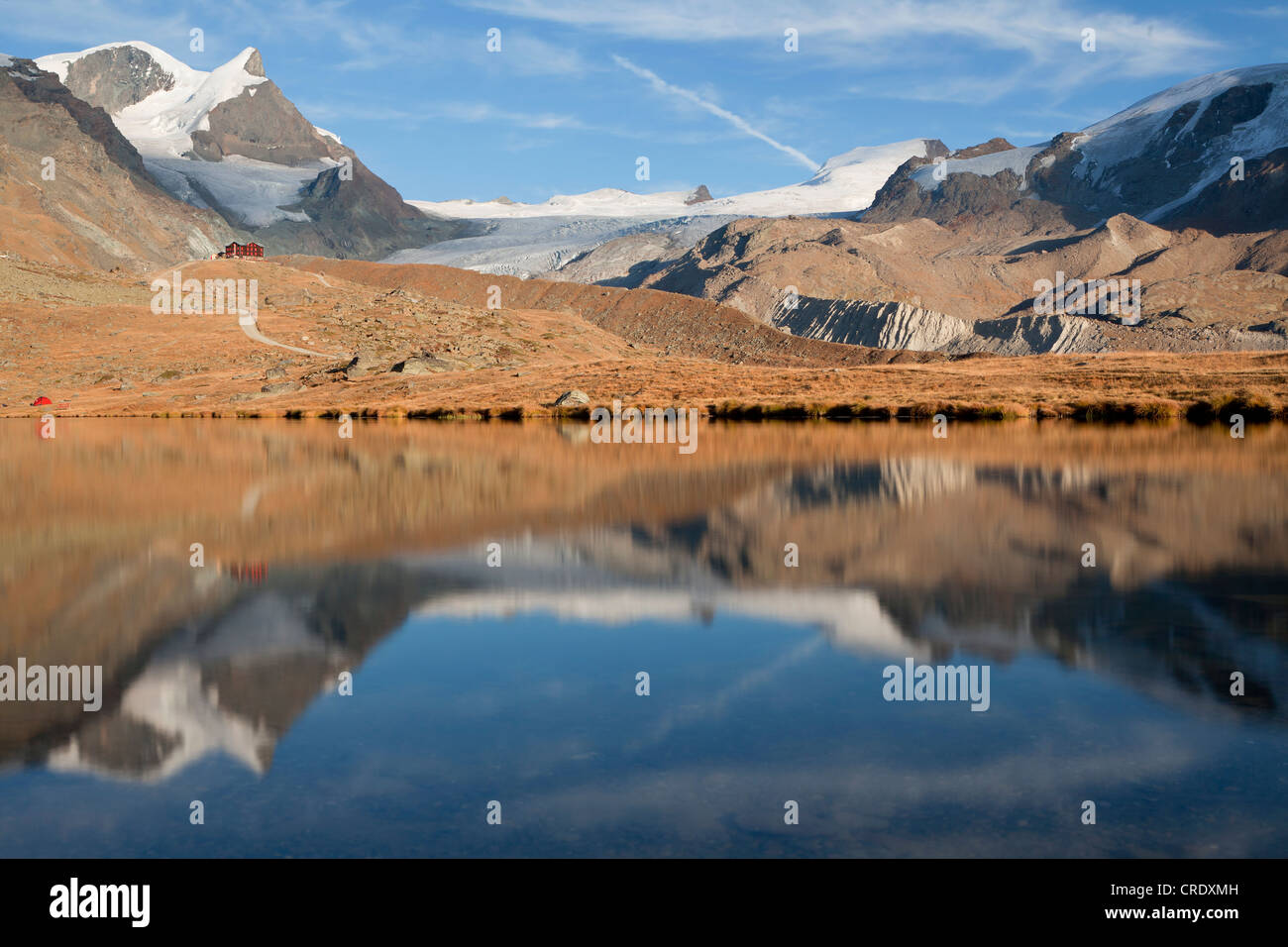 Fluhalp restaurant near Stellisee lake in the evening light, Zermatt ...