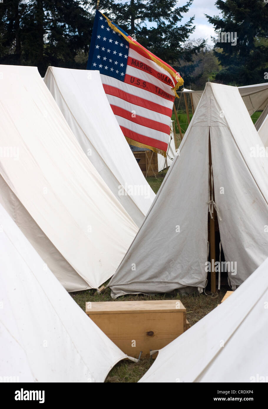 Tents and a flag in the military camp Stock Photo - Alamy