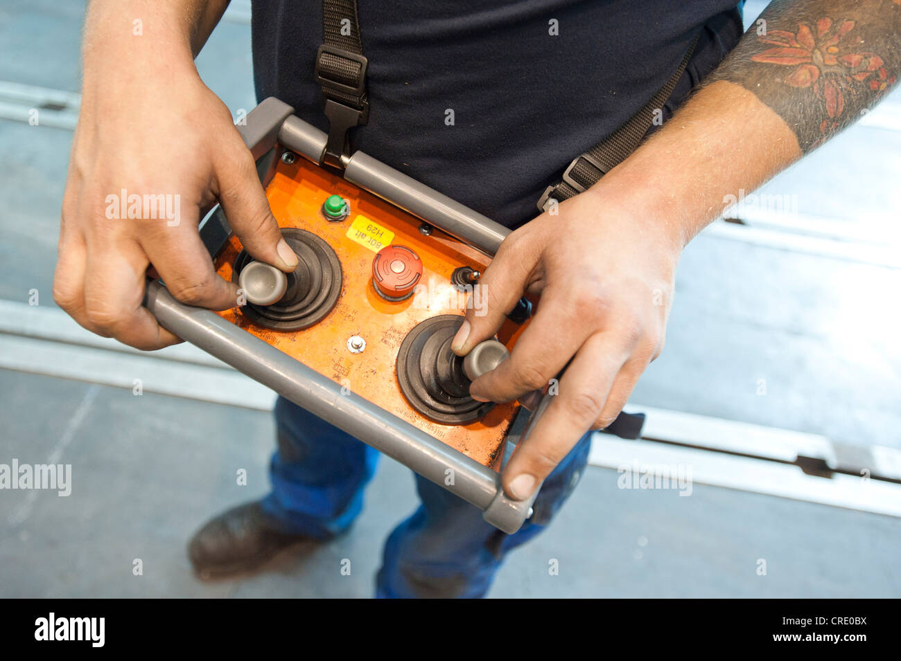 Crane operator, hands on a remote control, assembly works Stock Photo ...