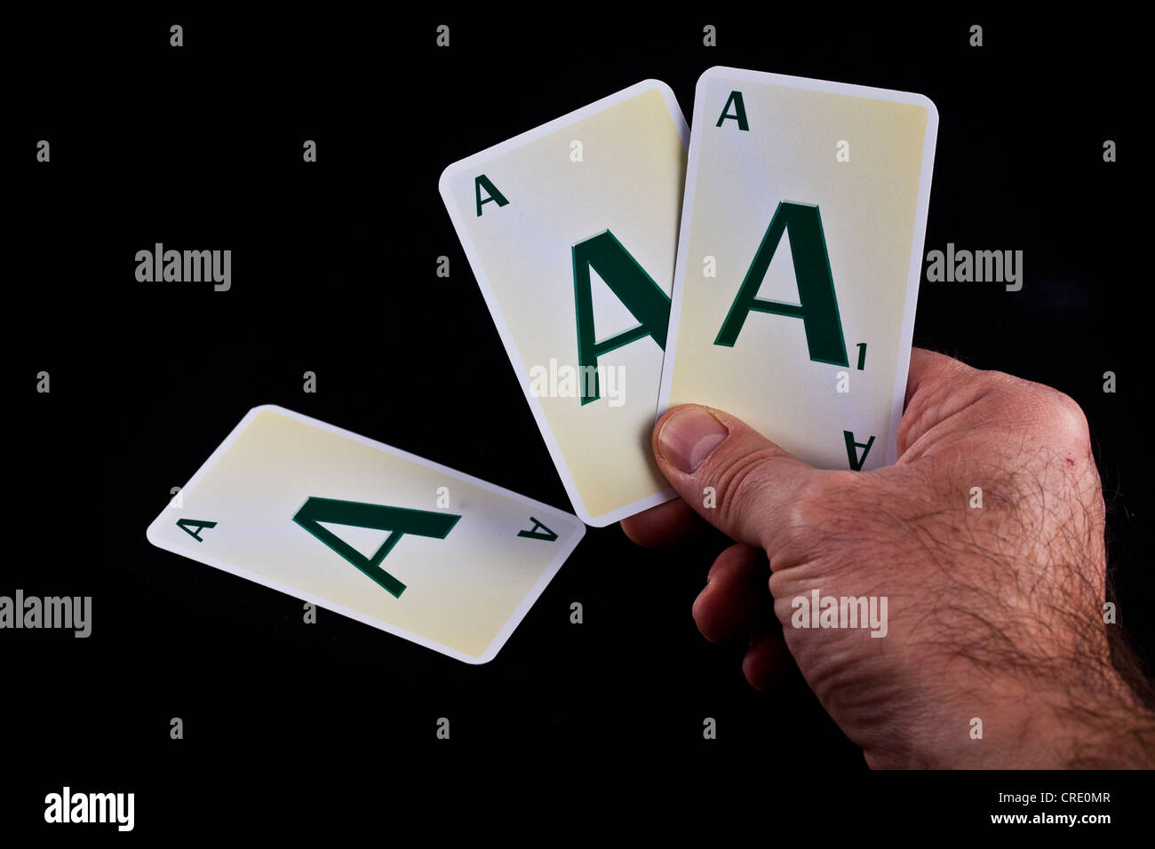 Three playing cards with an A on it, symbolic image for a triple-A ...